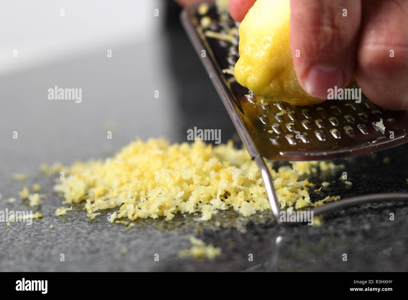 Grating lemon. Making Shoofly Tart Series Stock Photo - Alamy