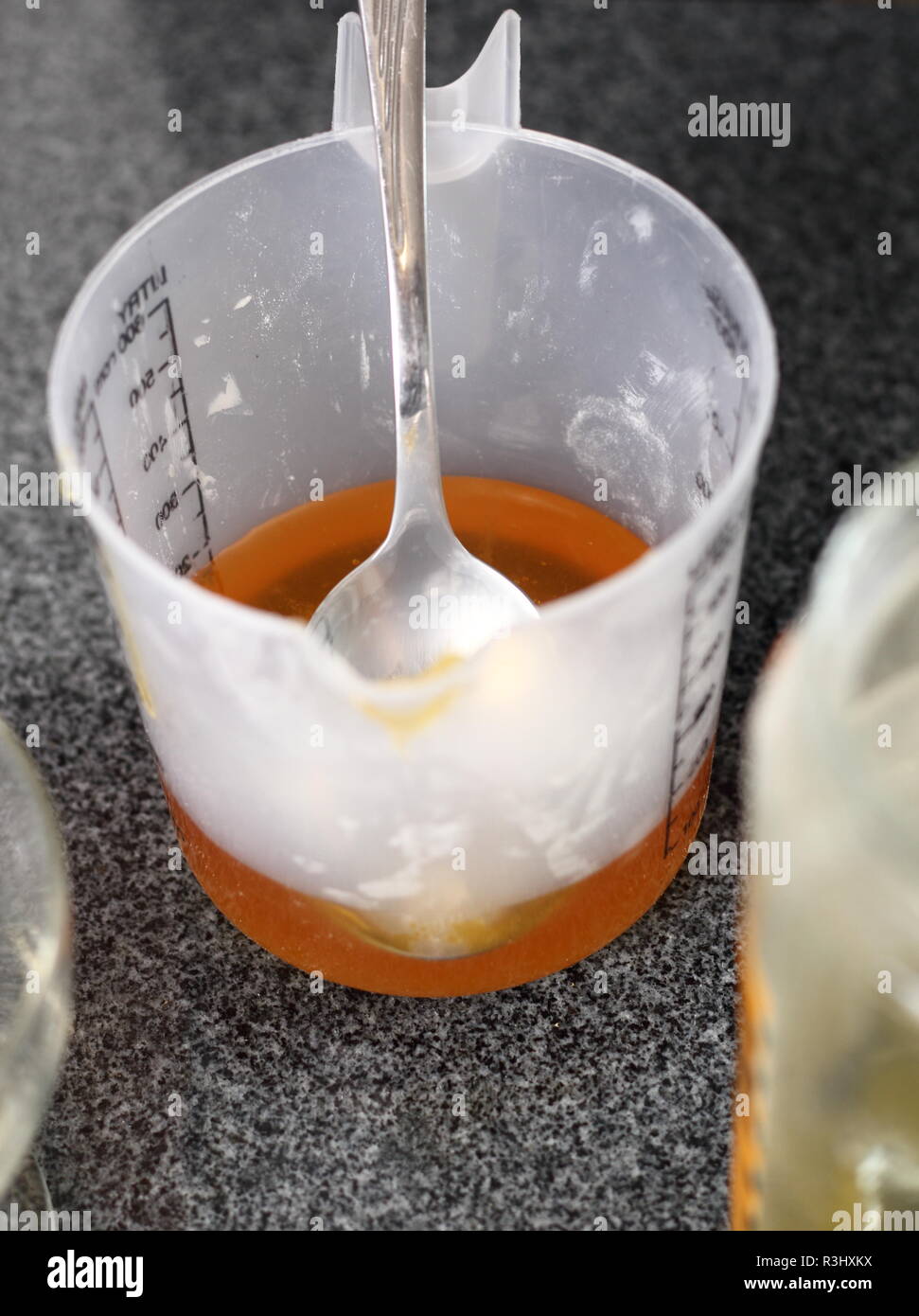 Golden syrup in measuring cup with spoon. Making Shoofly Tart Series ...