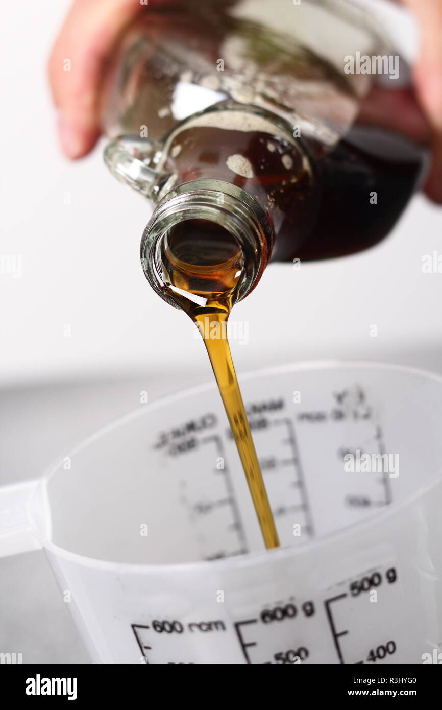 Pouring Maple Syrup into Measuring Cup. Making Cider Pie Series Stock ...