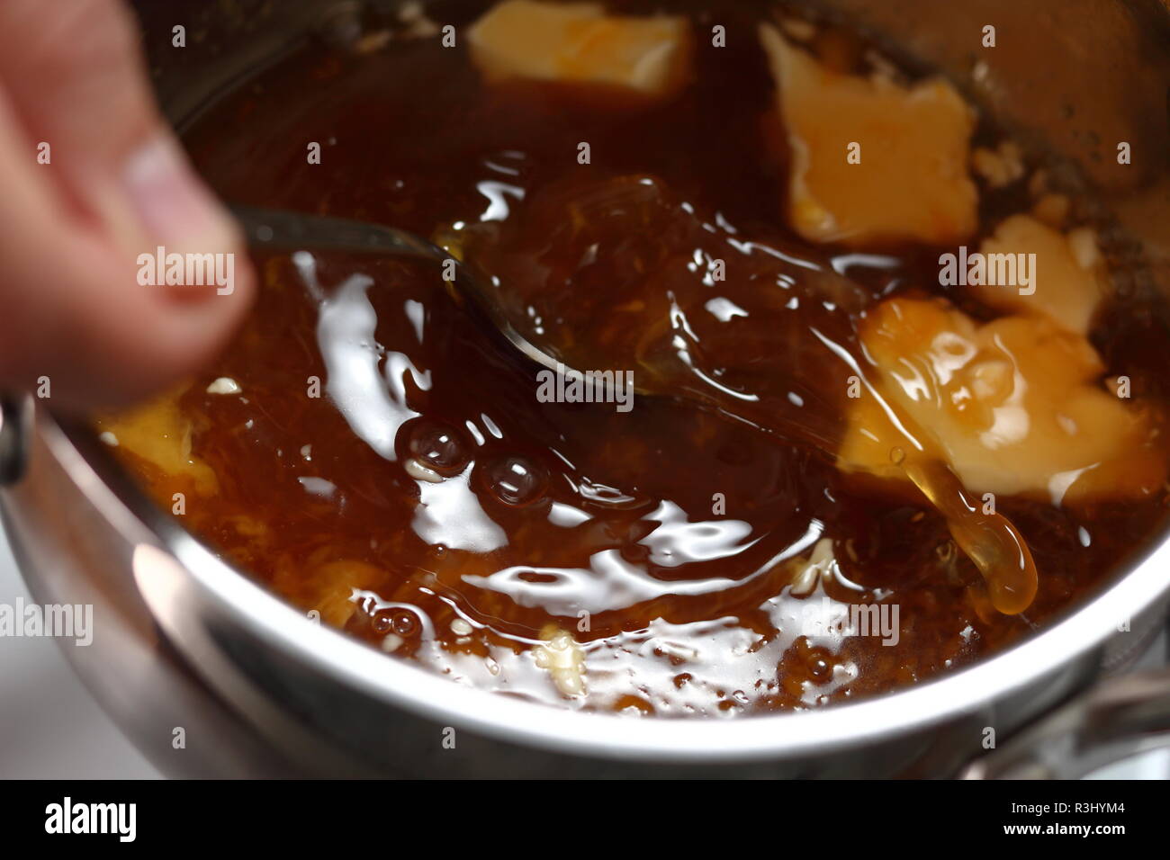 Melting ingredients of filling mixture. Making Cider Pie Series Stock ...