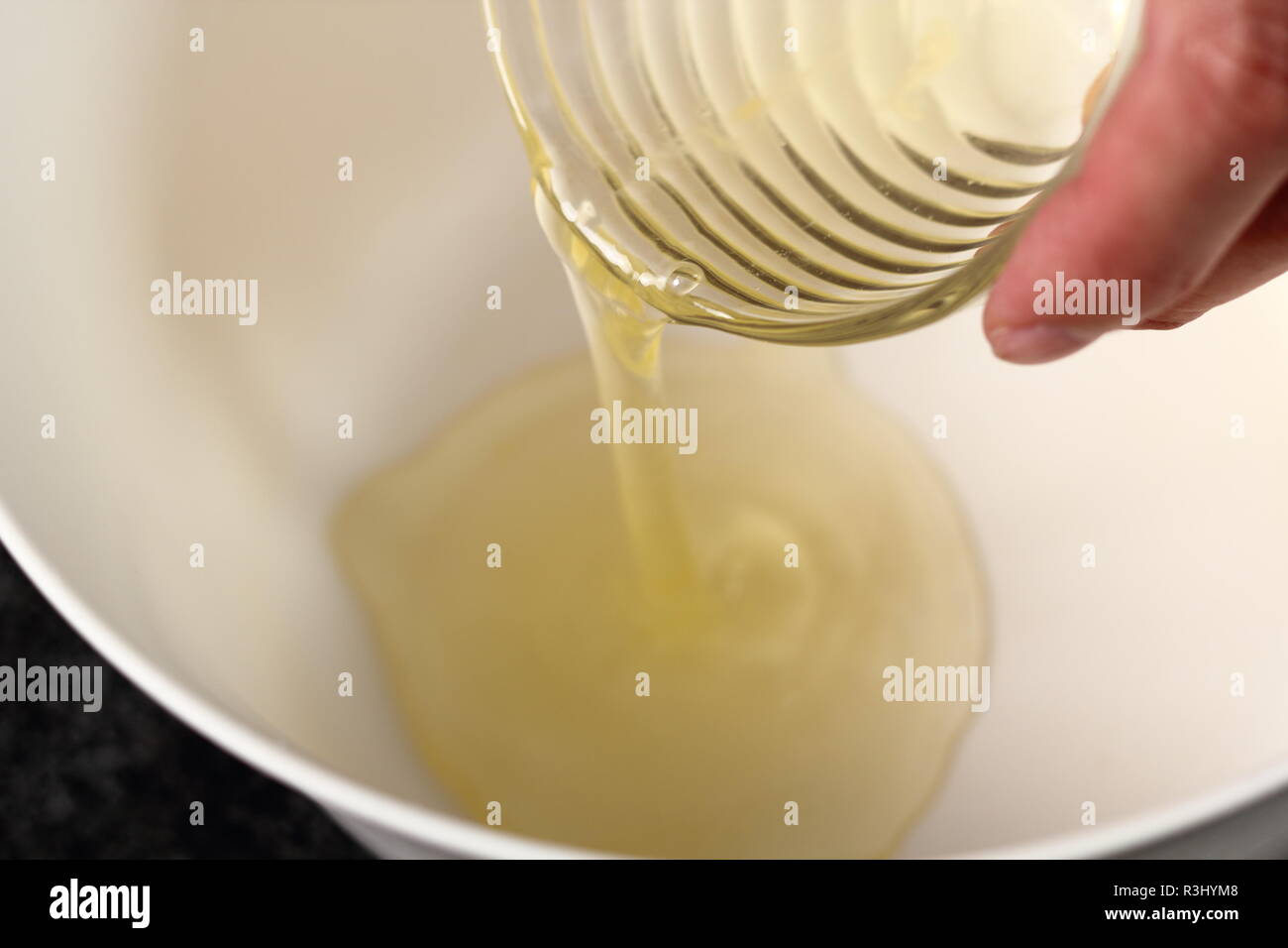 Pouring egg whites into bowl. Making Cider Pie Series Stock Photo - Alamy