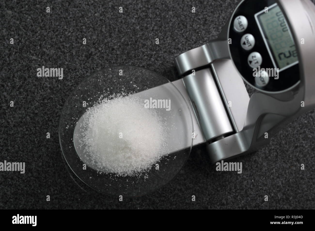 Weighing sugar on kitchen scale. Making Golden Syrup Series Stock Photo ...