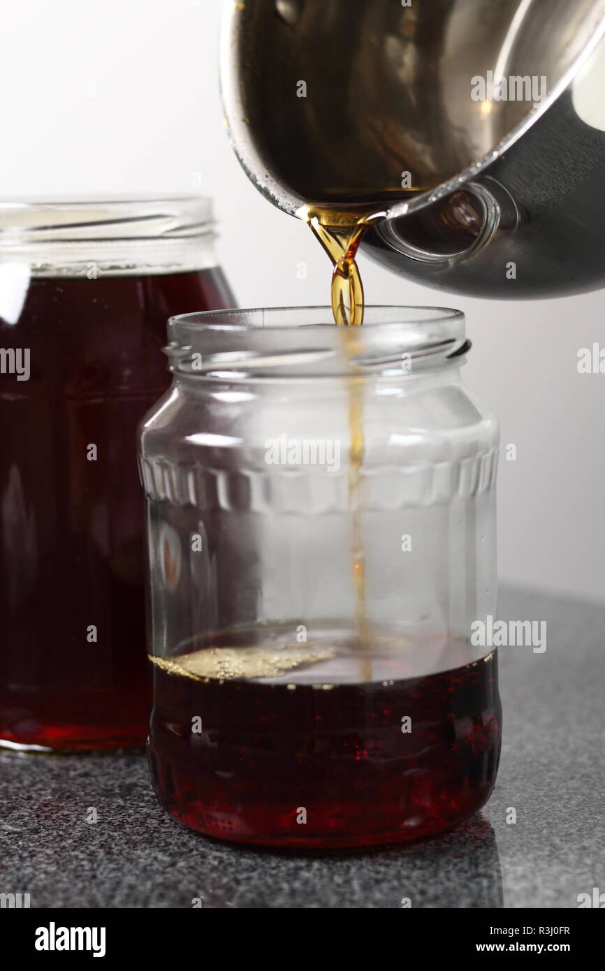 Syrup pouring into saucepan hi-res stock photography and images - Alamy