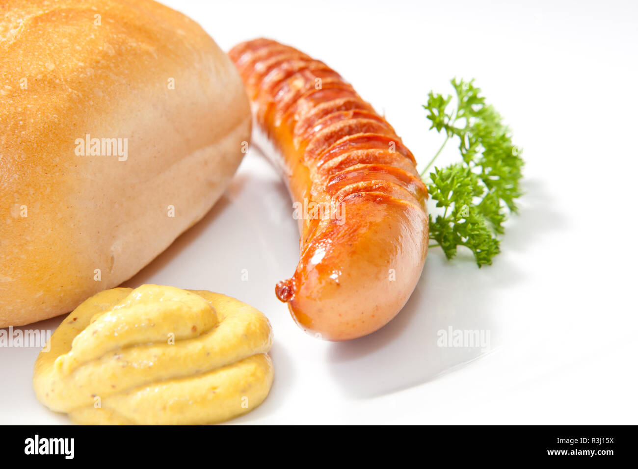 grilled sausage - bratwurst with mustard,bread and parsley Stock Photo ...