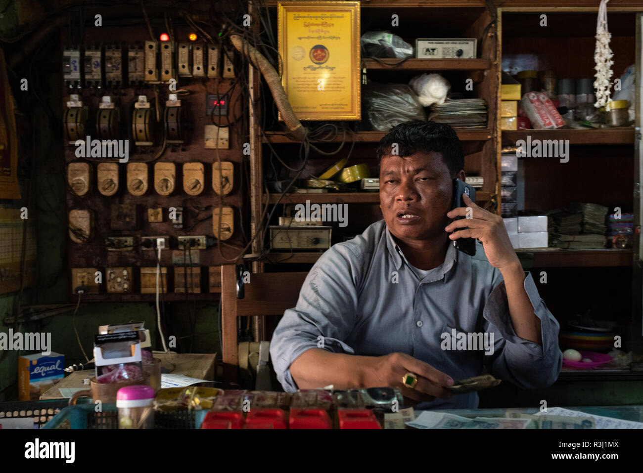 Proprietor of a cafe in the Htin Tone Market, Mandalay, Myanmar Stock ...