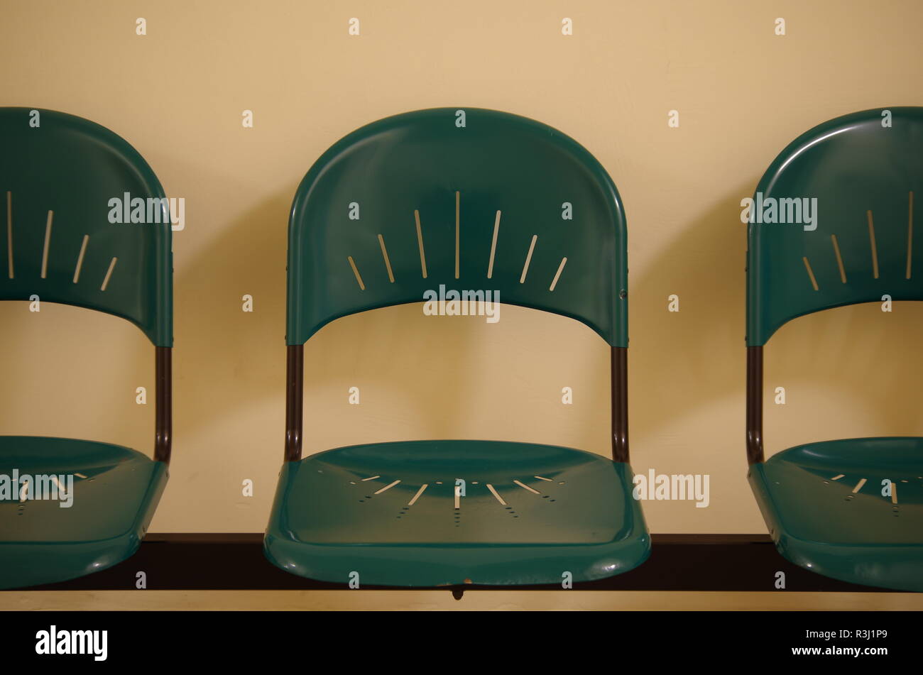 green chair row Stock Photo - Alamy