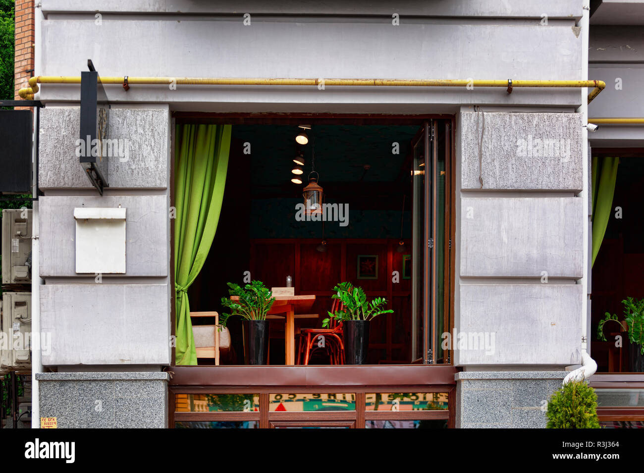 Stained glass window in cafe of modern city. Cozy interior of cafe ...