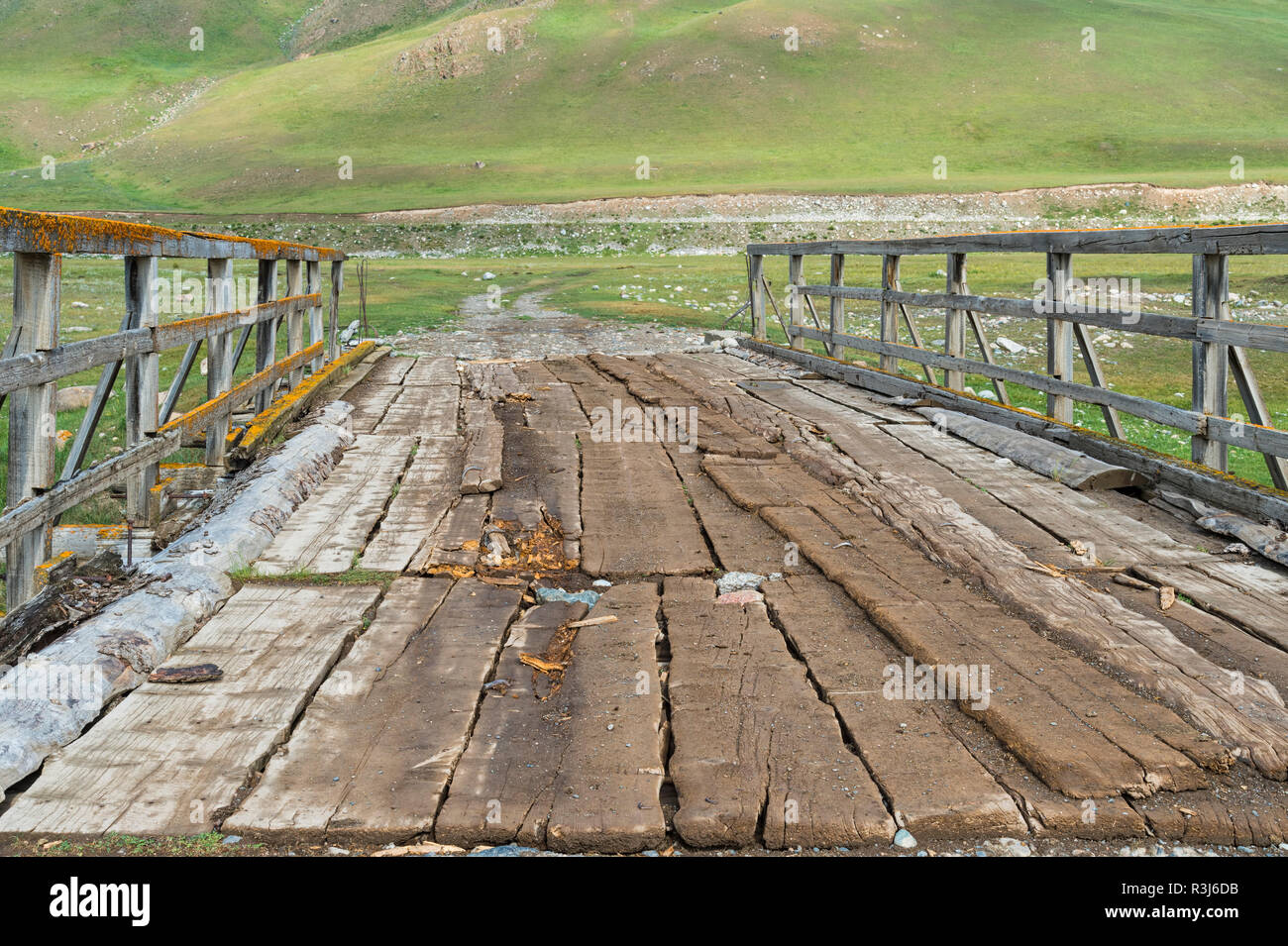 Old wooden bridge over a Mountain river, Naryn gorge, Naryn Region ...