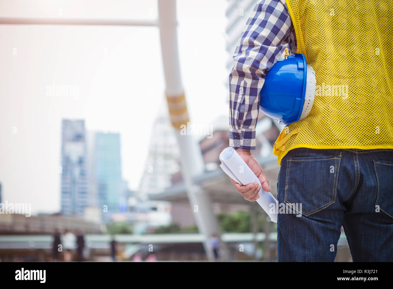 Engineering and construction concept. Closeup engineer with blueprint ...