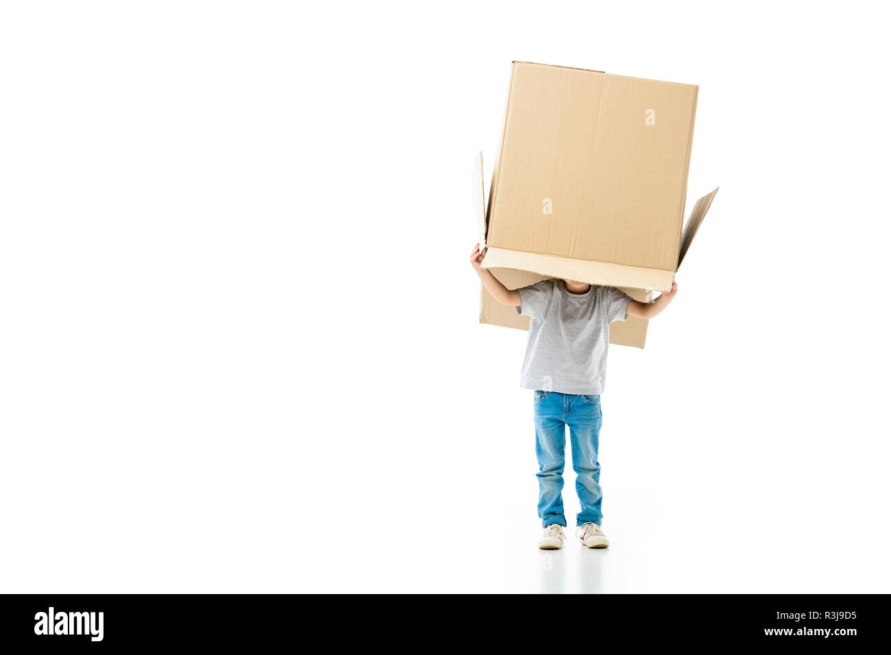 Little boy hiding in the paper box isolated on white Stock Photo - Alamy