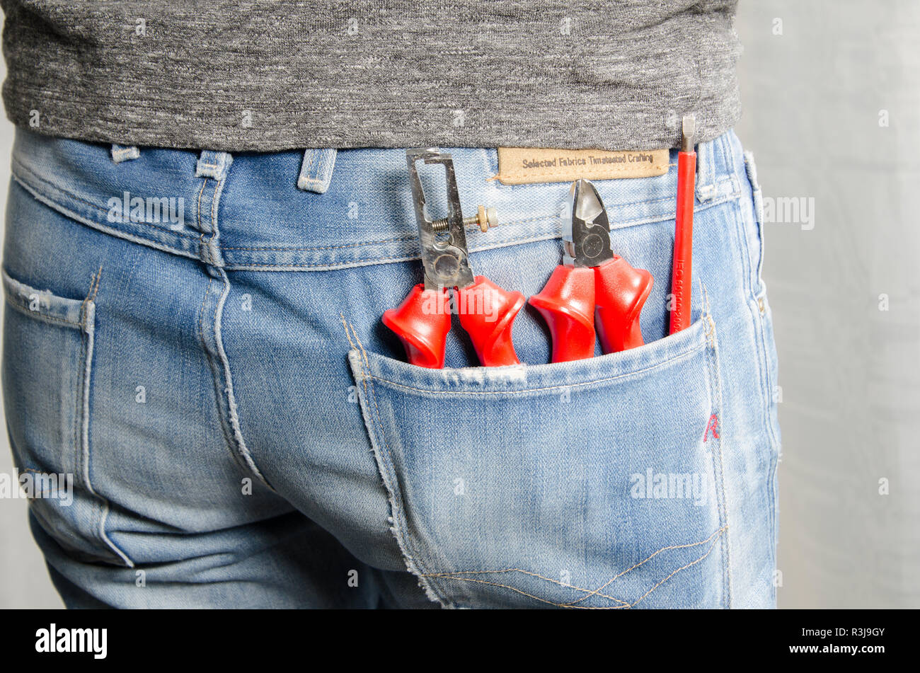 electricians tool in your pocket Stock Photo - Alamy
