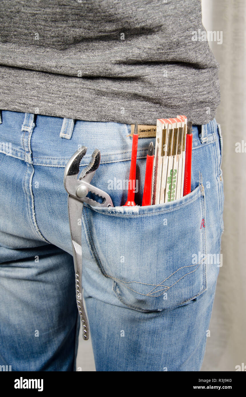 plumbing tool in your pocket Stock Photo - Alamy