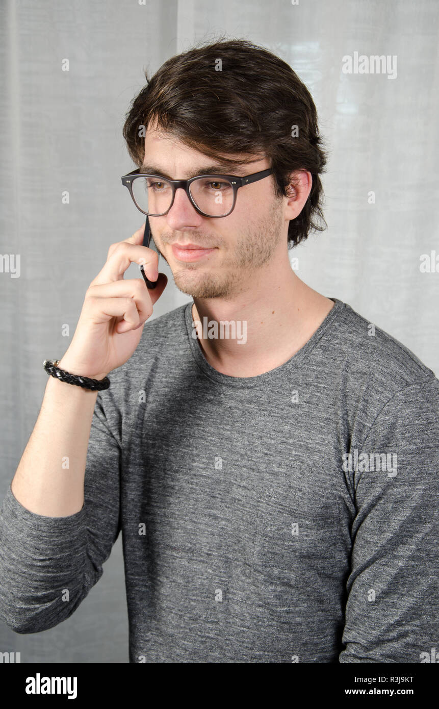 young man phoning Stock Photo - Alamy