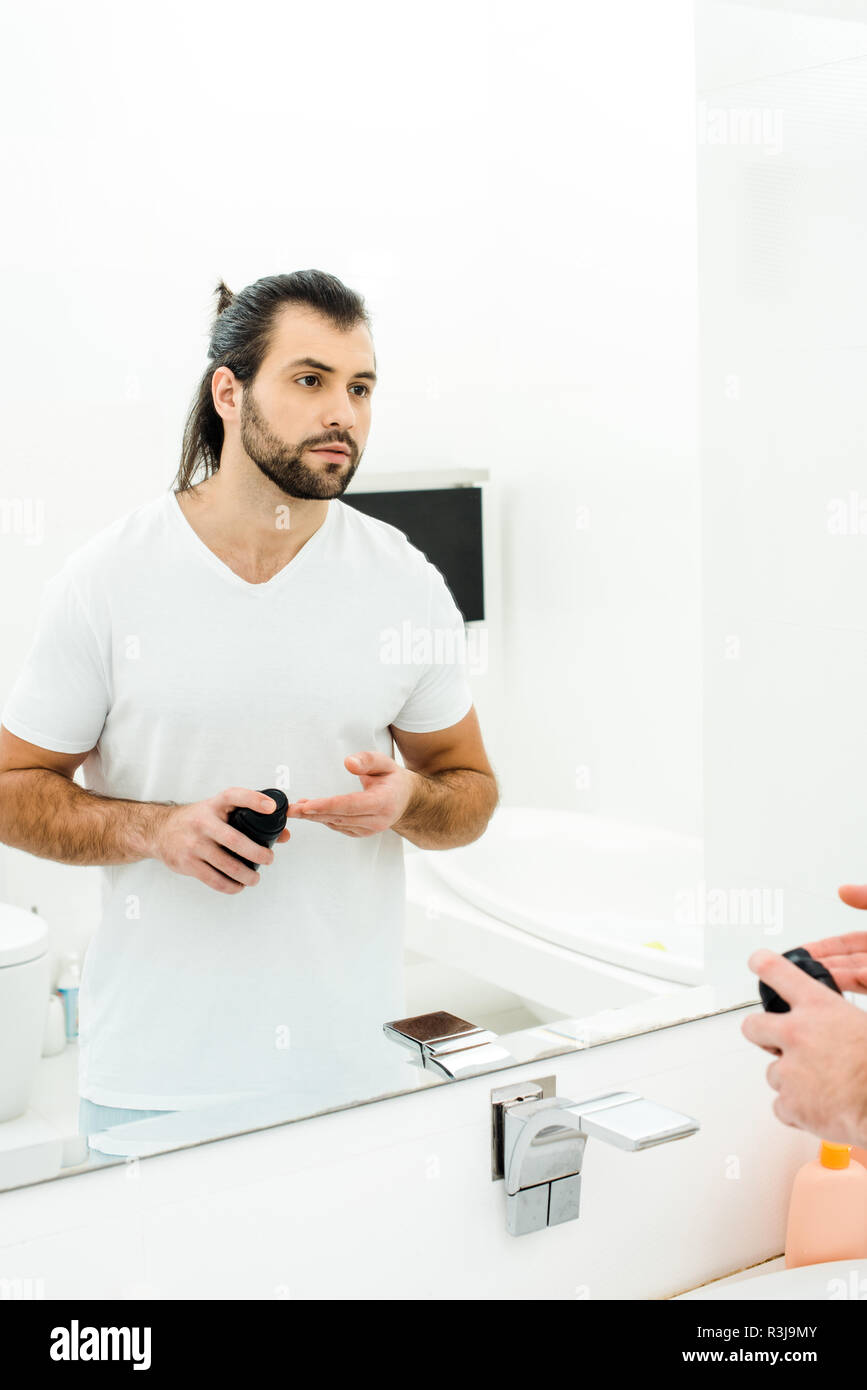 handsome man applying shaving foam on fingers in bathroom Stock Photo - Alamy