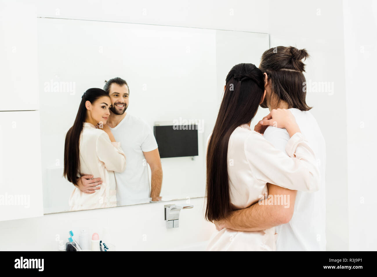 Couple hugging in bathroom hi-res stock photography and images - Alamy