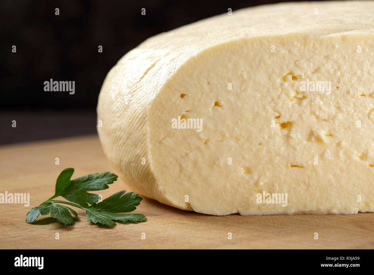 Cas - Romanian traditional cheese on a wooden cutting board - close up ...