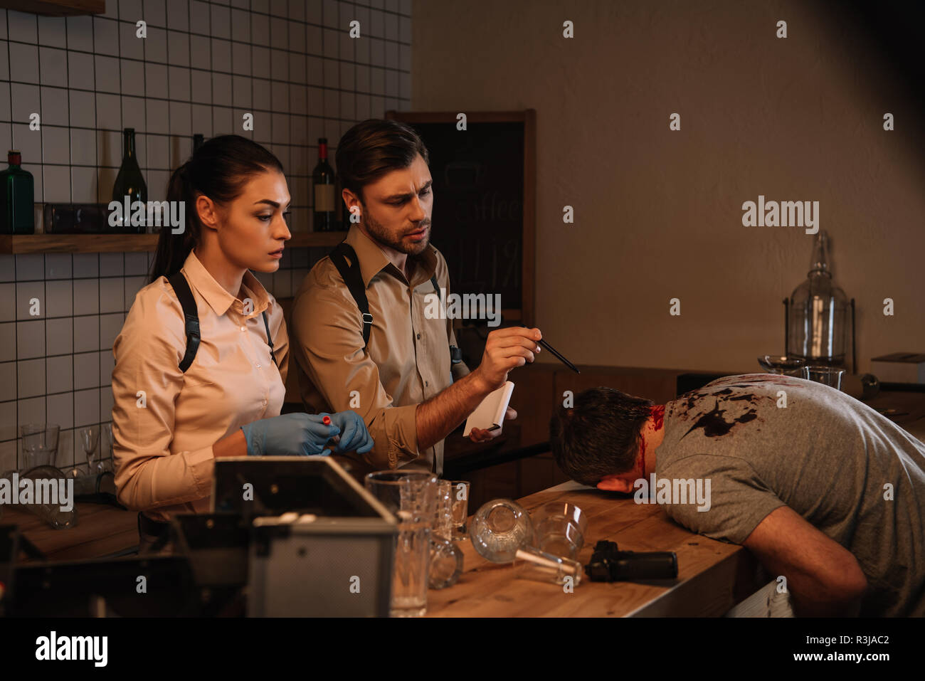 Serious Female And Male Detectives Using Evidence Collection Kit And