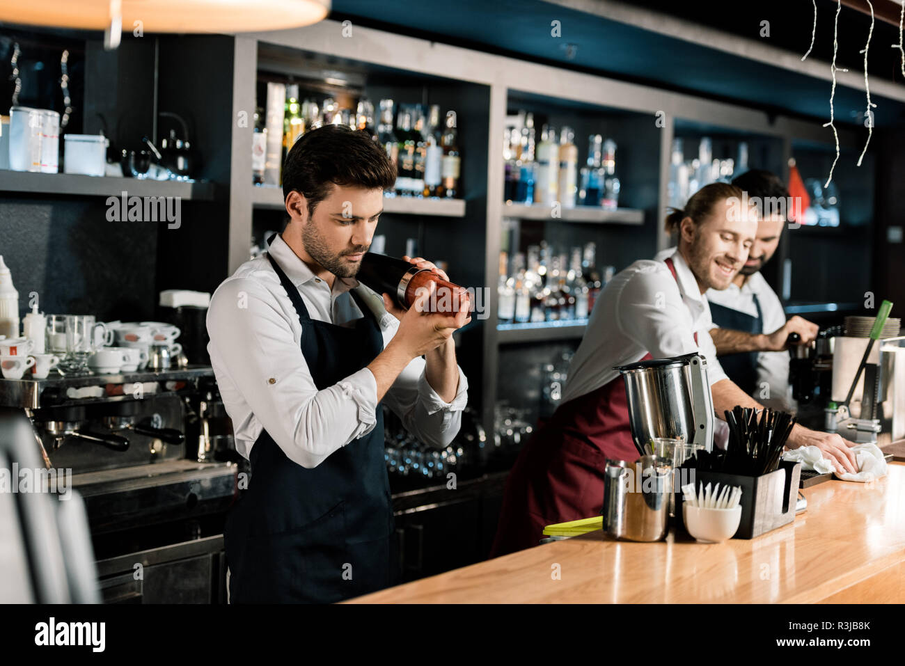 Barman work shaking cocktail in hi-res stock photography and images - Alamy