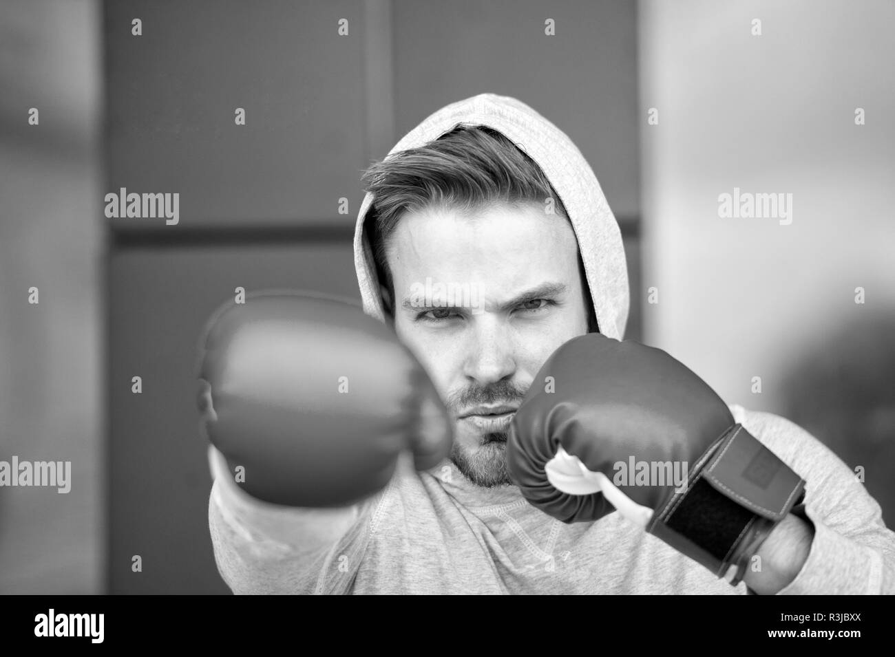 Boxing concept. Man athlete on concentrated face with sport gloves ...