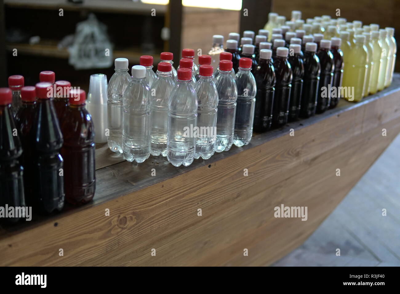 many plastic bottles with a liquid of a different Stock Photo - Alamy