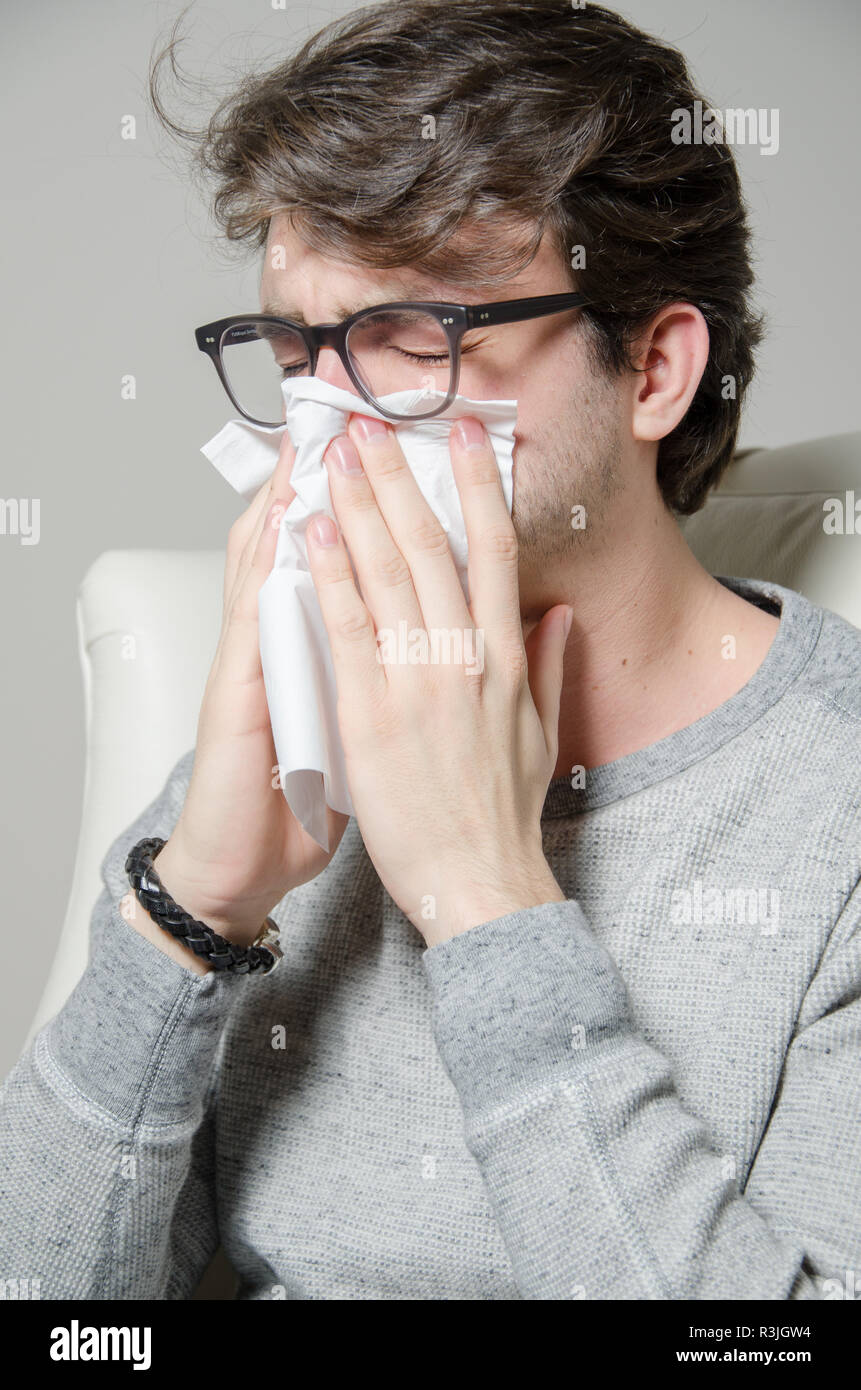 young man has a cold Stock Photo - Alamy