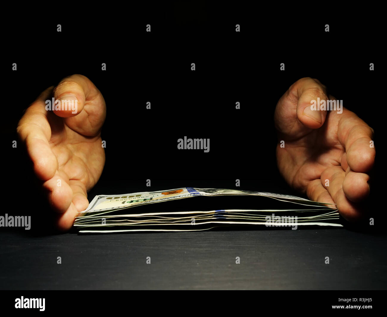 Hands offer money in the dark Free space. Lending and loan concept ...