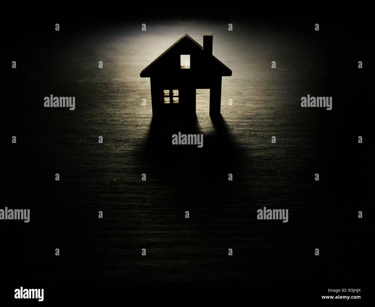 Model of house in the dark. Mortgage and real estate investment Stock ...