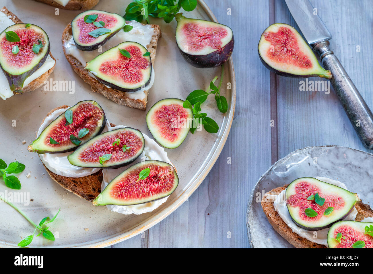 Goat cheese and figs on toast - healthy lunch idea - top view Stock ...