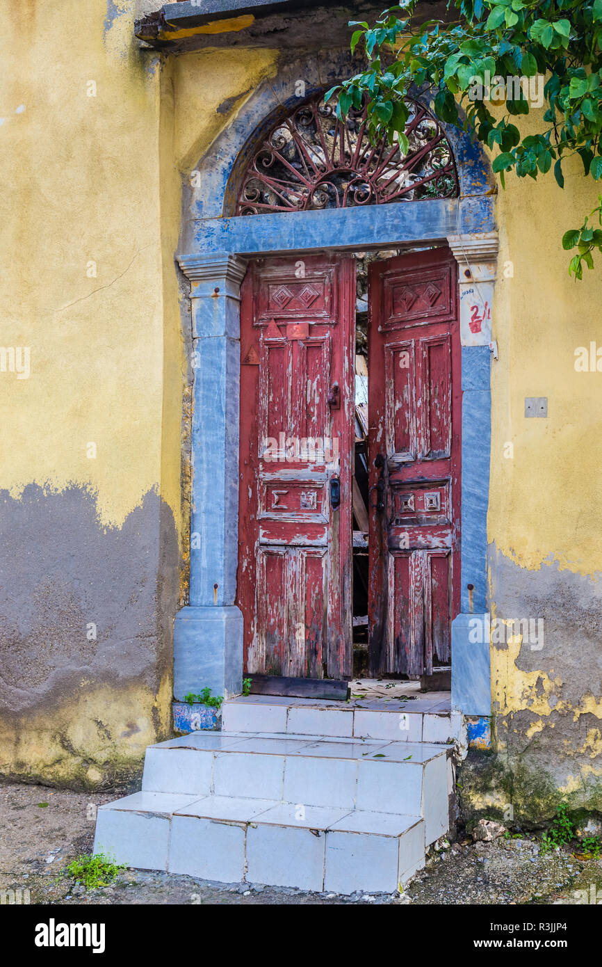 Old wooden door at the entrance to a derelict house Stock Photo - Alamy