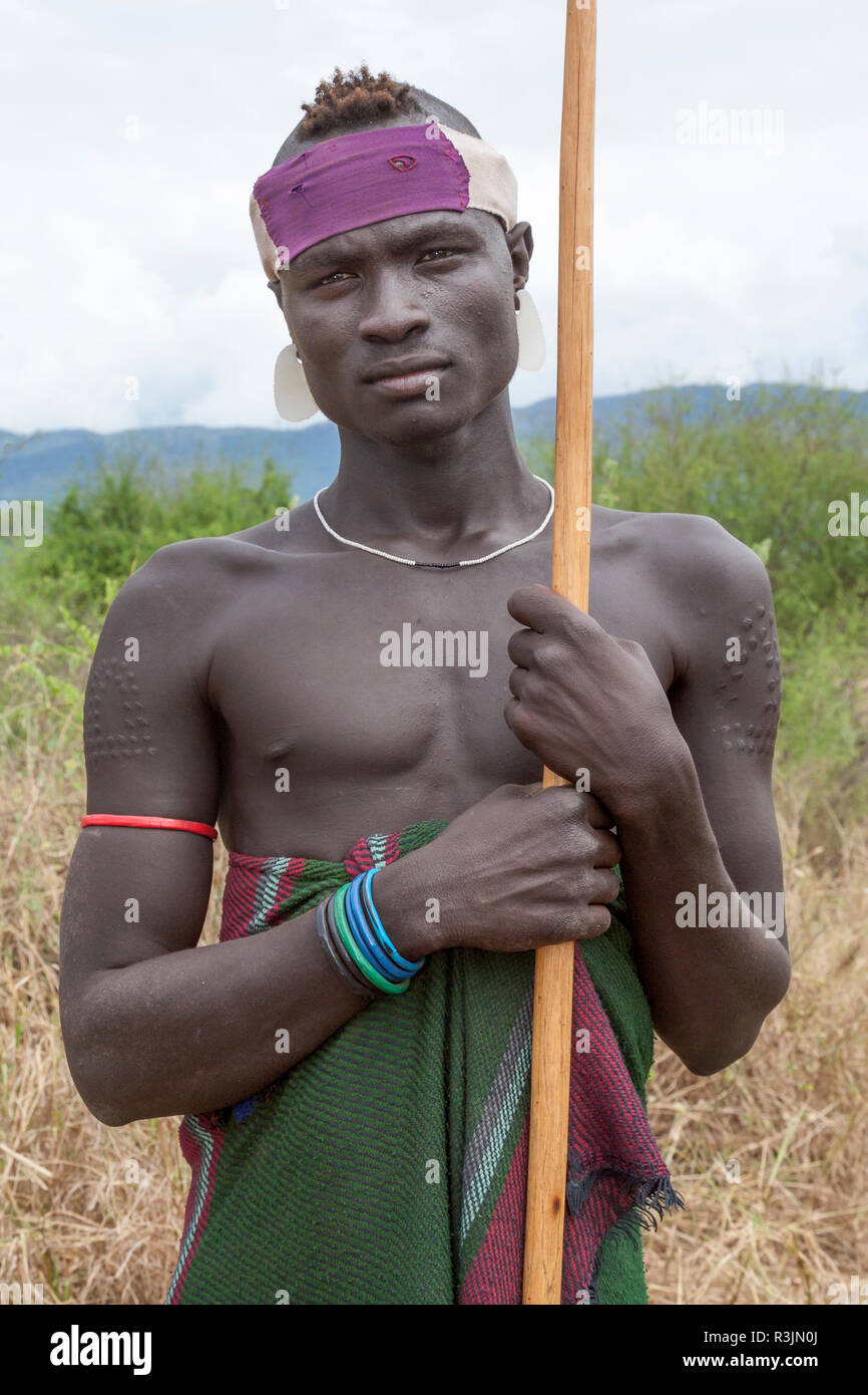 Africa, Ethiopia, Southern Omo Valley, Mursi Tribe. Portrait of a young ...