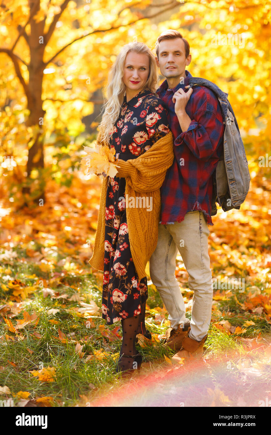 Image of embracing couple on walk in autumn forest Stock Photo - Alamy