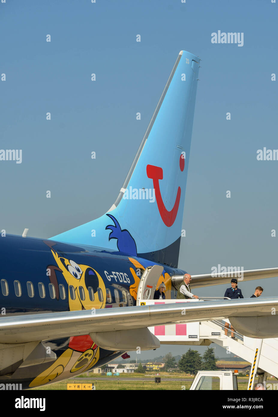 Passengers leaving a TUI holiday jet after arriving at Verona airport ...