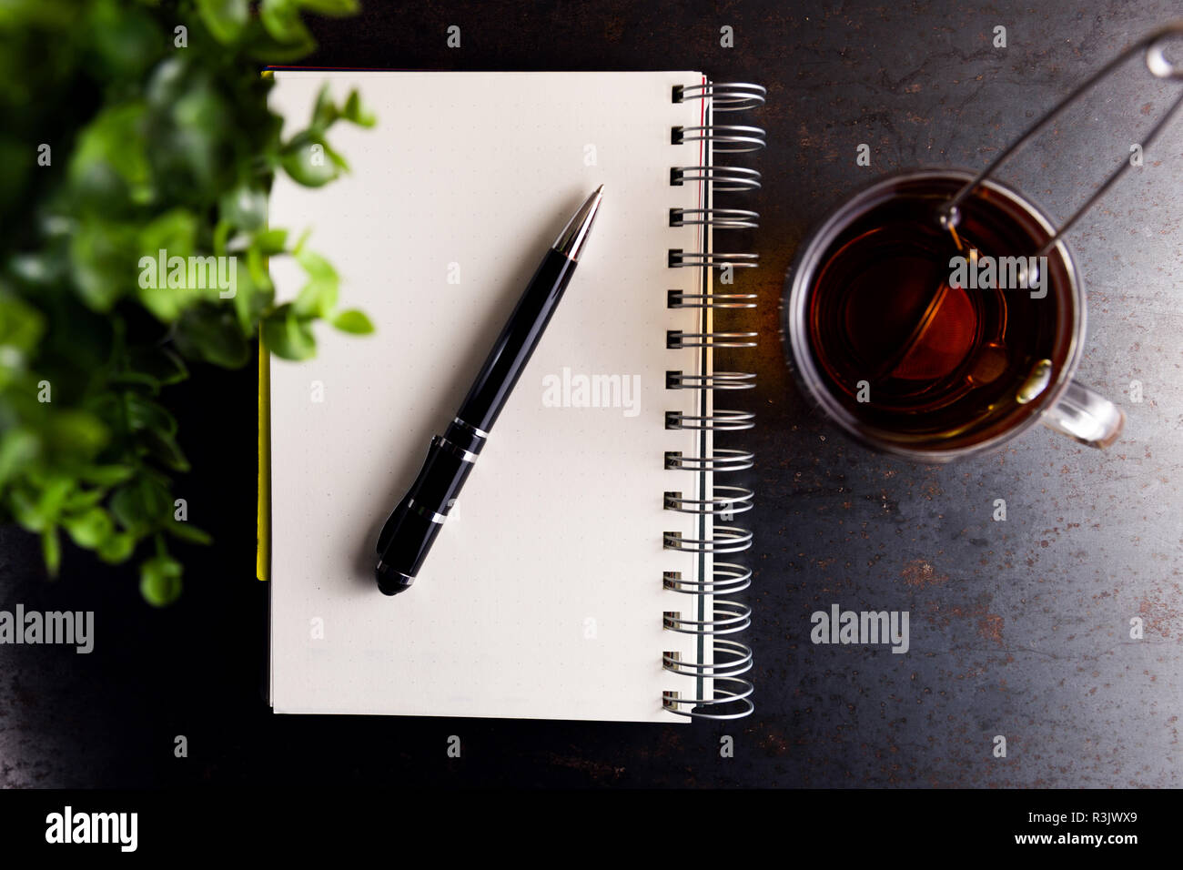 Notebook with a pencil on a rusty metal background Stock Photo - Alamy