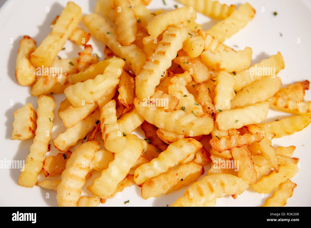 Chips, chrinkle chips cooked, french fries food Stock Photo - Alamy