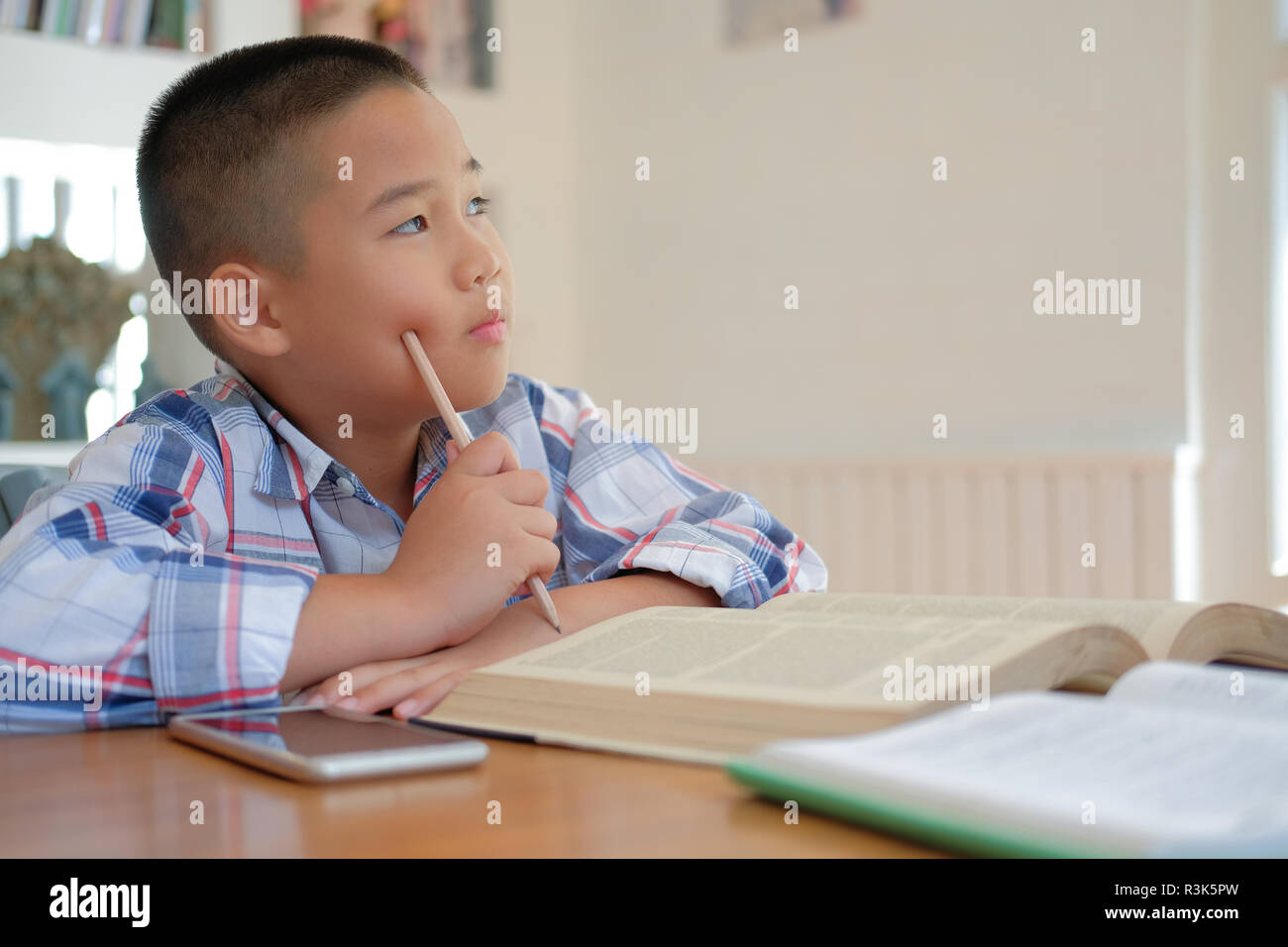 young little asian kid boy child children schoolboy thinking. childhood ...