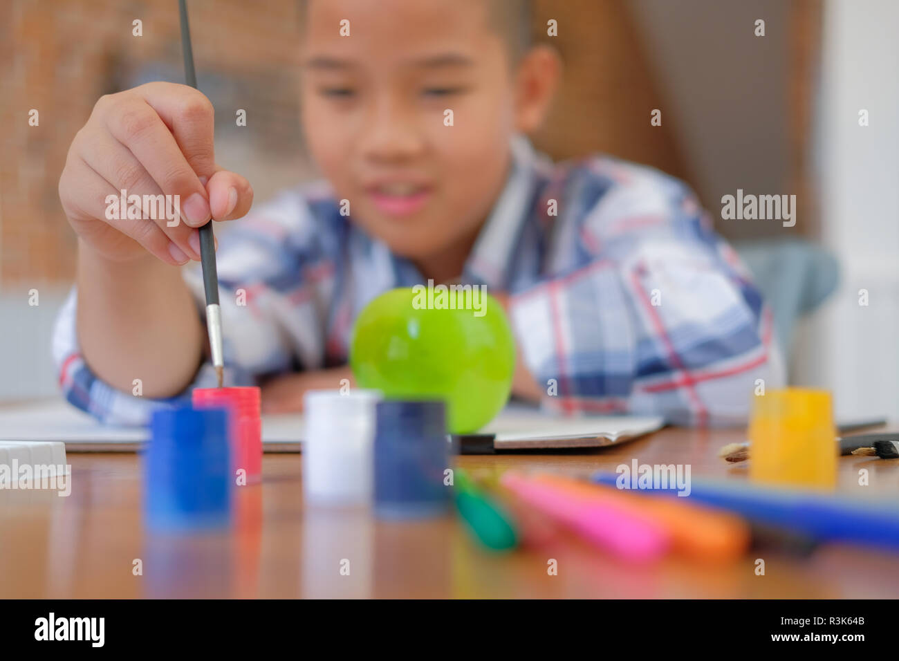 little asian kid boy child schoolboy holding paint brush drawing ...