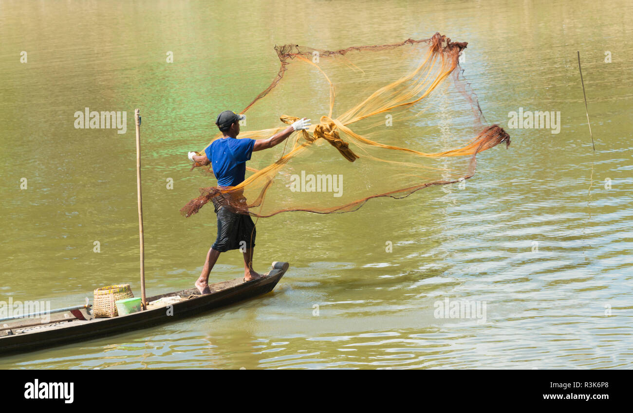 Fisherman fishing on the river, Bago, Bago Region, Myanmar Stock Photo ...