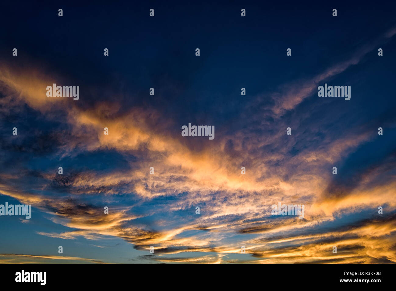 Dramatic blue sunset sky with pink clouds Stock Photo - Alamy
