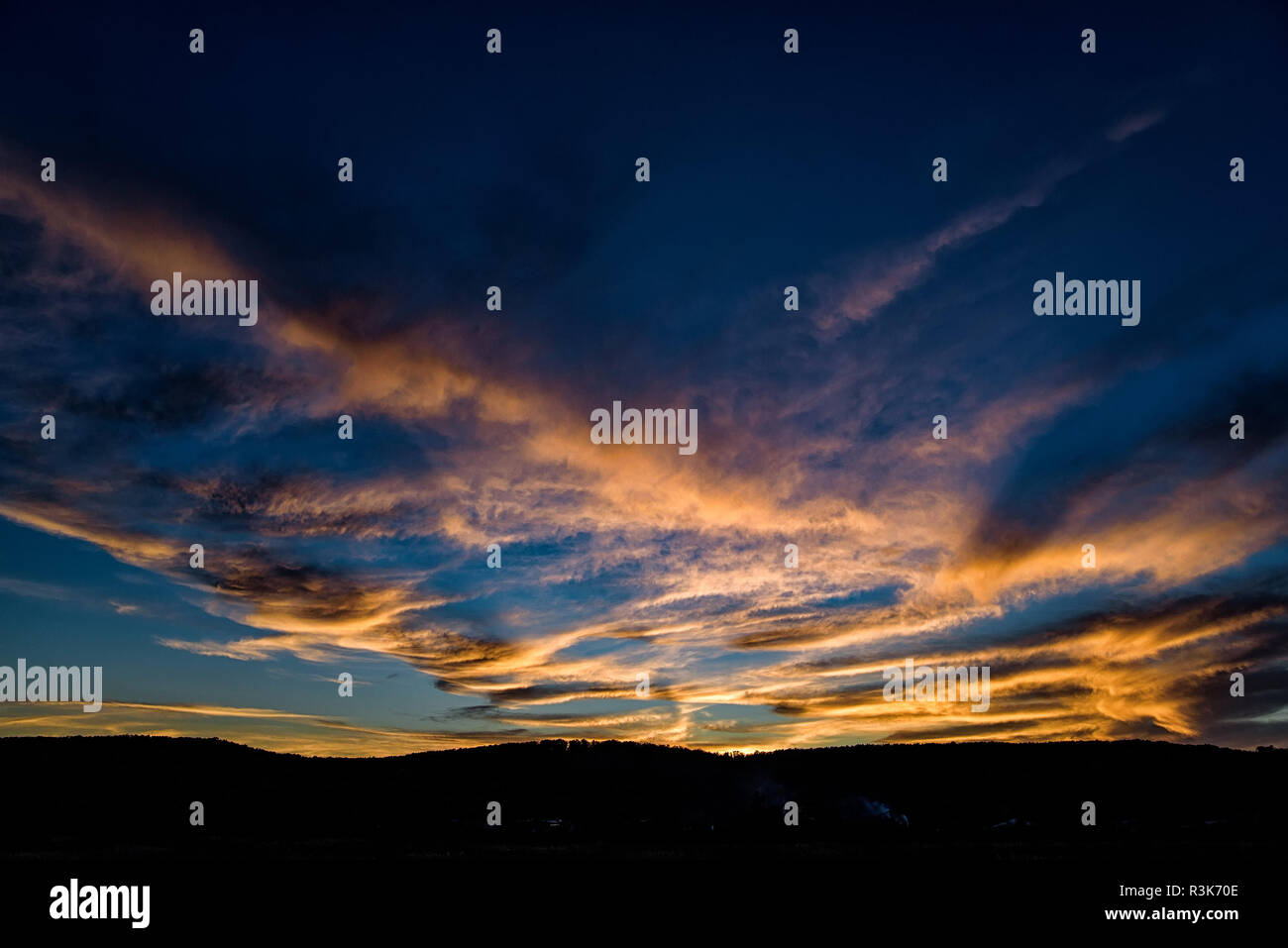 Dramatic blue sunset sky with pink clouds Stock Photo - Alamy