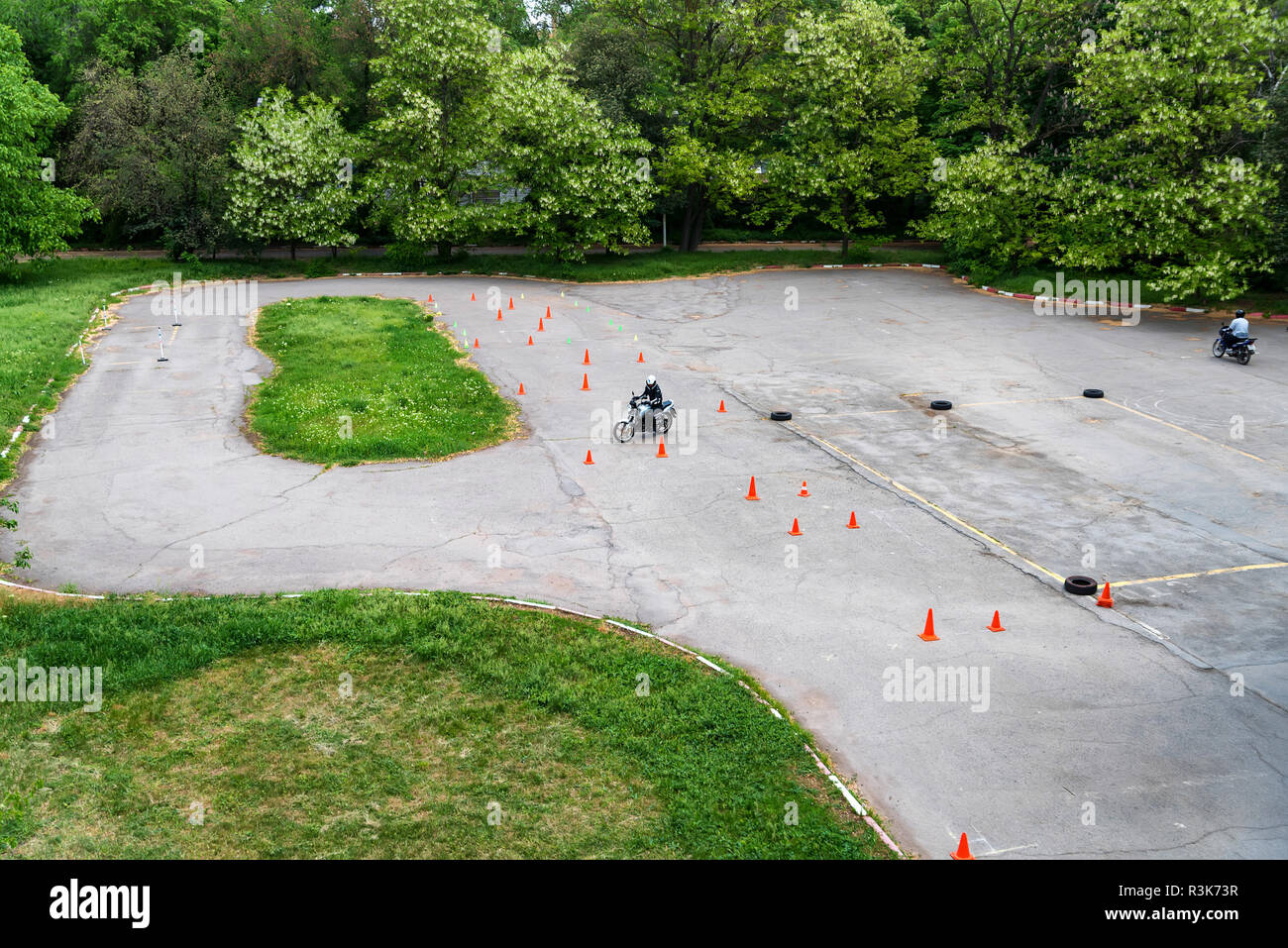 Man is practicing driving a motorcycle in a driving school Stock Photo ...