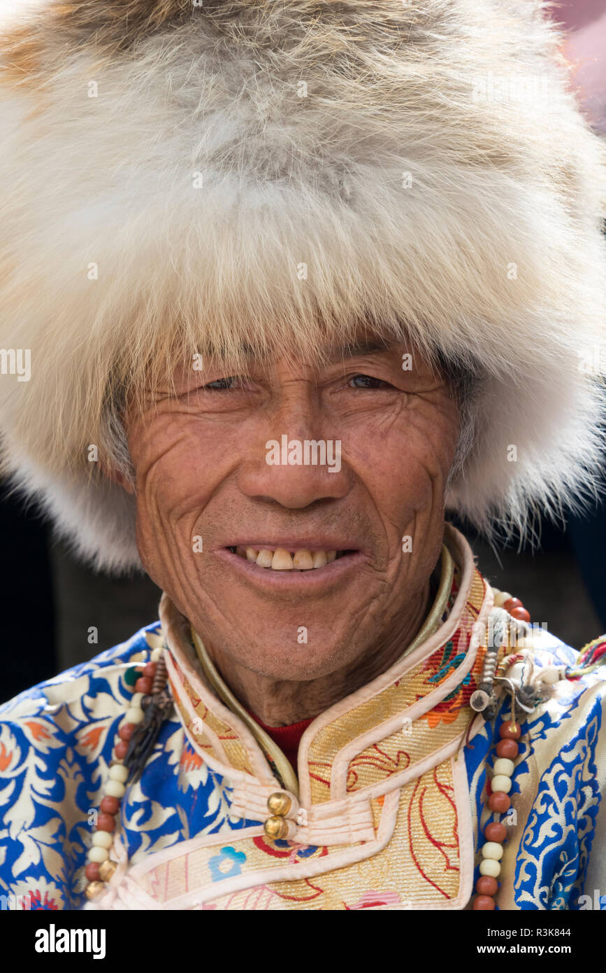 Jiarong Tibetan man in traditional clothing, Jinchuan, Sichuan Province ...