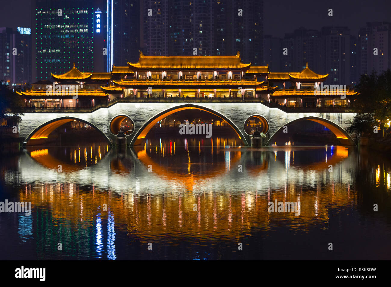 Night view of Anshun Bridge with reflection in Jin River, Chengdu ...