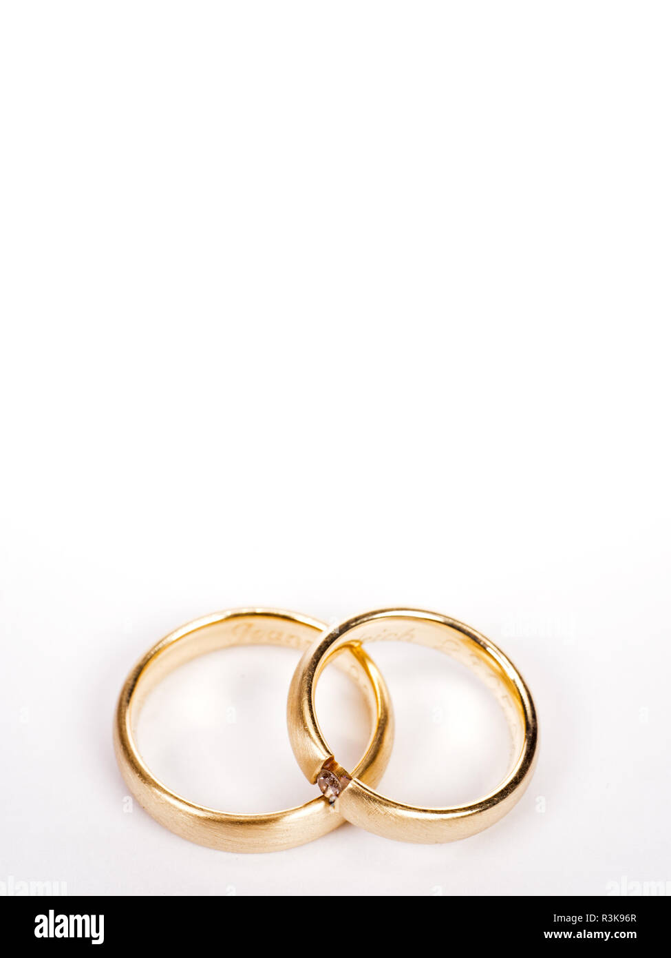 wedding rings on a white background Stock Photo - Alamy