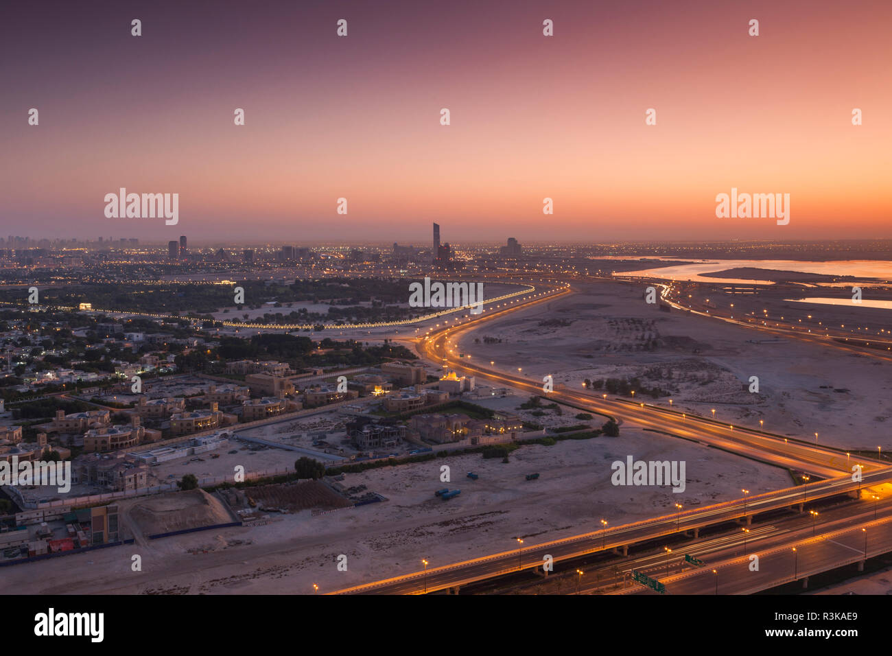 UAE, Downtown Dubai. Elevated desert and highway view towards Ras Al ...