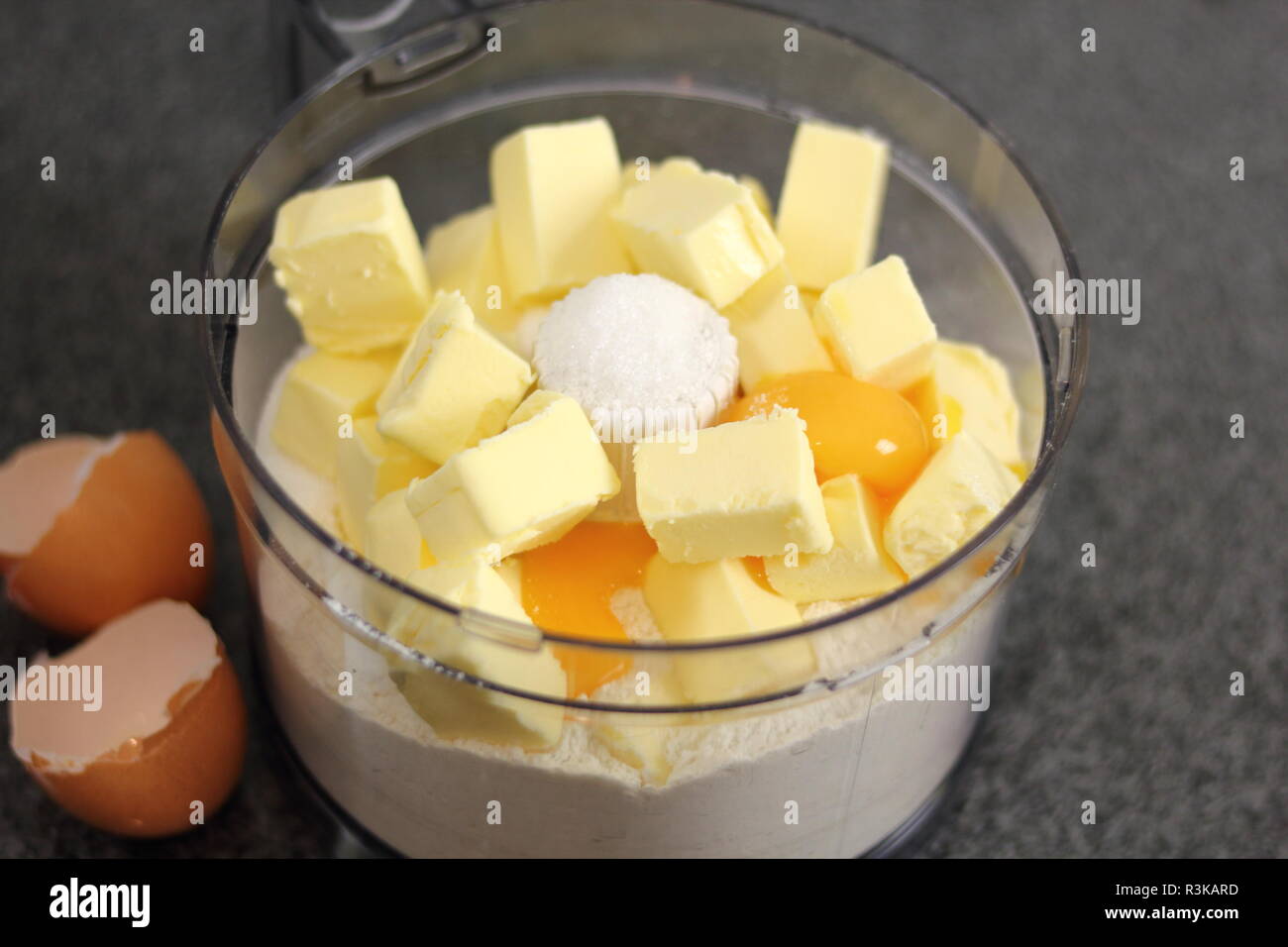 Making dough. Diced butter, eggs and flour in food processor. Making ...