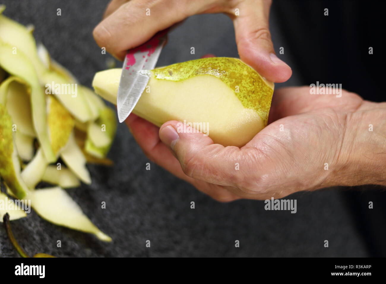 Peeling pears. Making Chocolate, Pear and Pecan Pie Series Stock Photo ...