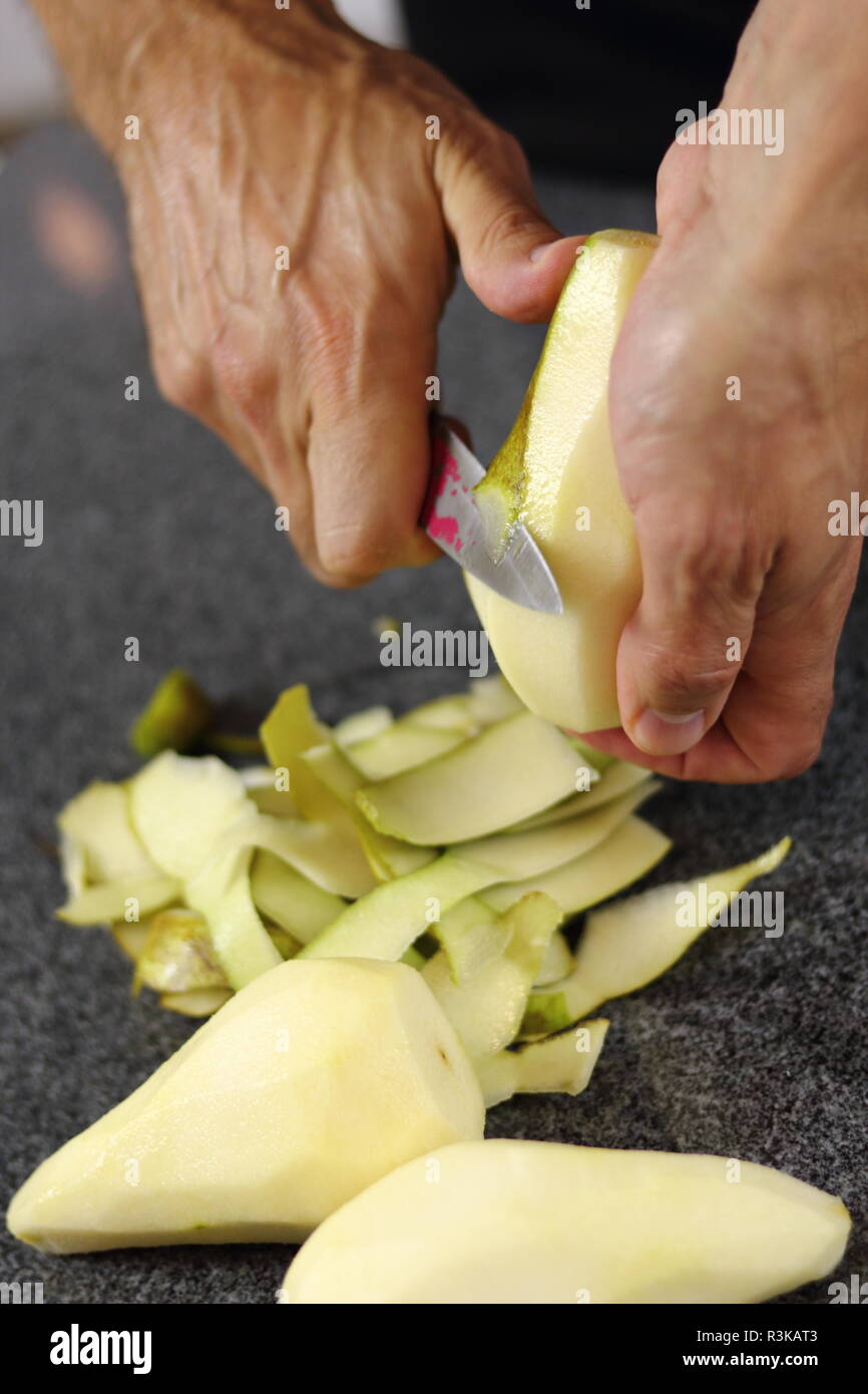 Peeling pears. Making Chocolate, Pear and Pecan Pie Series Stock Photo ...