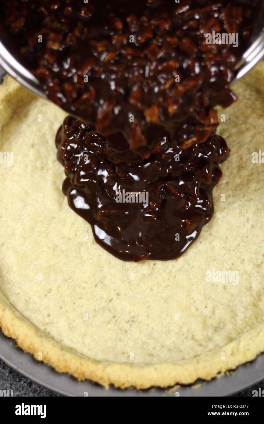 Pouring filling into pastry case. Making Chocolate, Pear and Pecan Pie ...