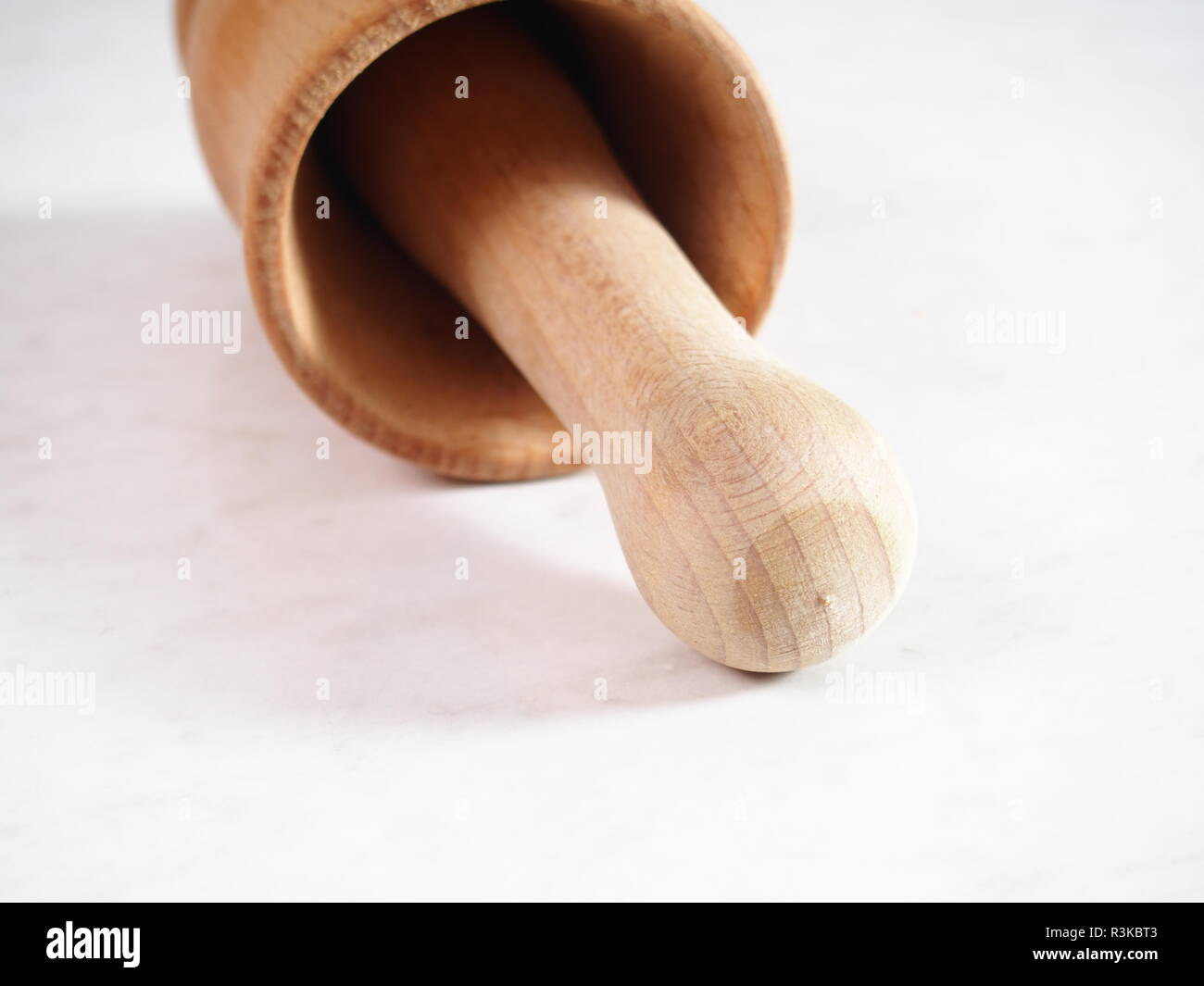 Wooden mortar and pestle on table Stock Photo - Alamy