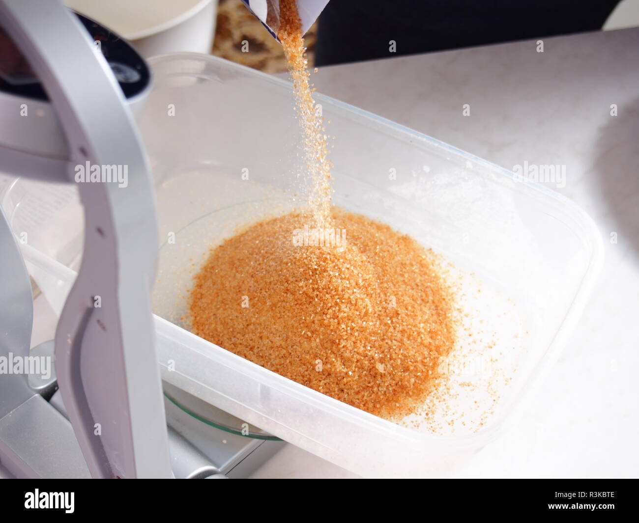 Weighing Brown Sugar. Making Treacle Pie Series Stock Photo - Alamy
